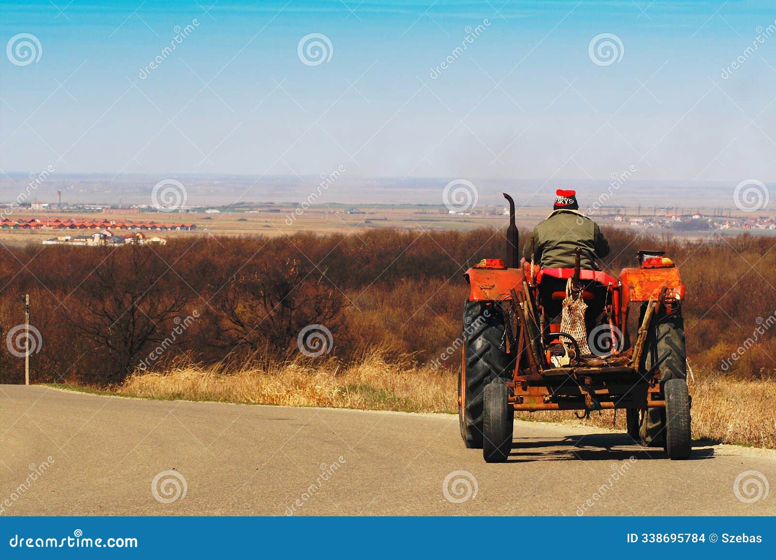 Tractor on the road stock photo. Image of villages, soil - 338695784