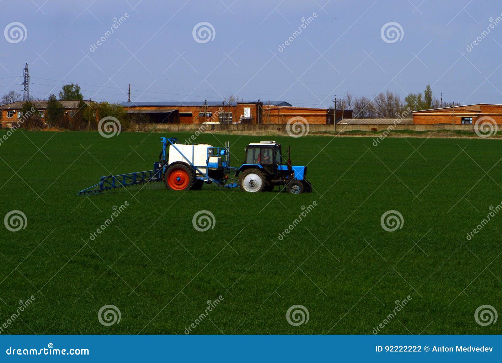 The Tractor Treats Crops from Parasites and Insects Stock Photo - Image ...
