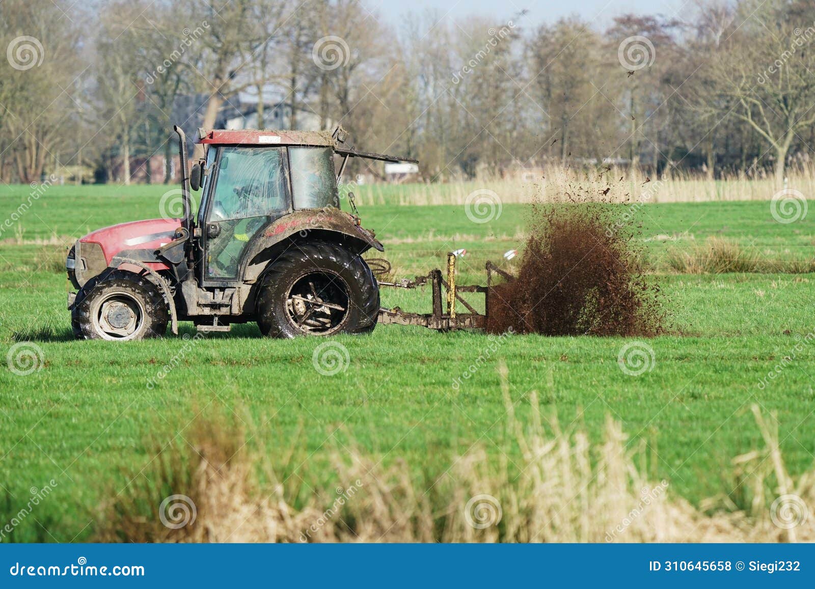 Tractor with trencher stock photo. Image of tractor - 310645658