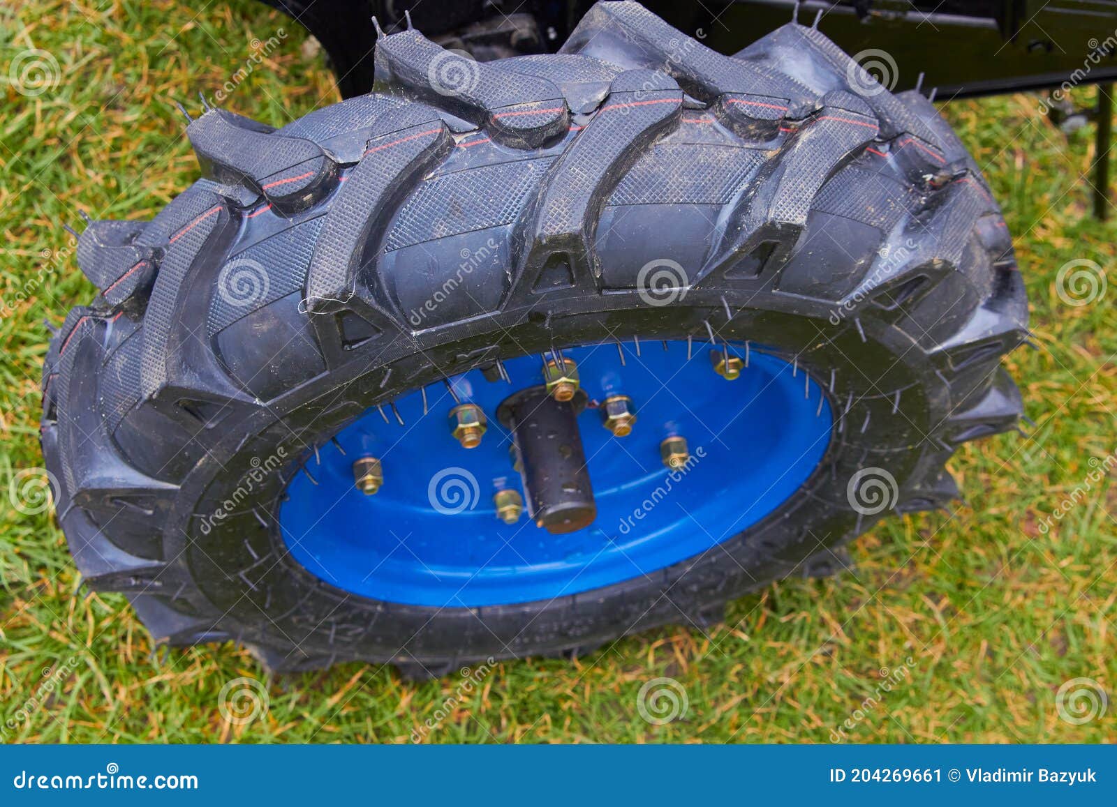 Tractor Wheel on the Grass,a New Wheel on a Tractor Stands on the Grass ...