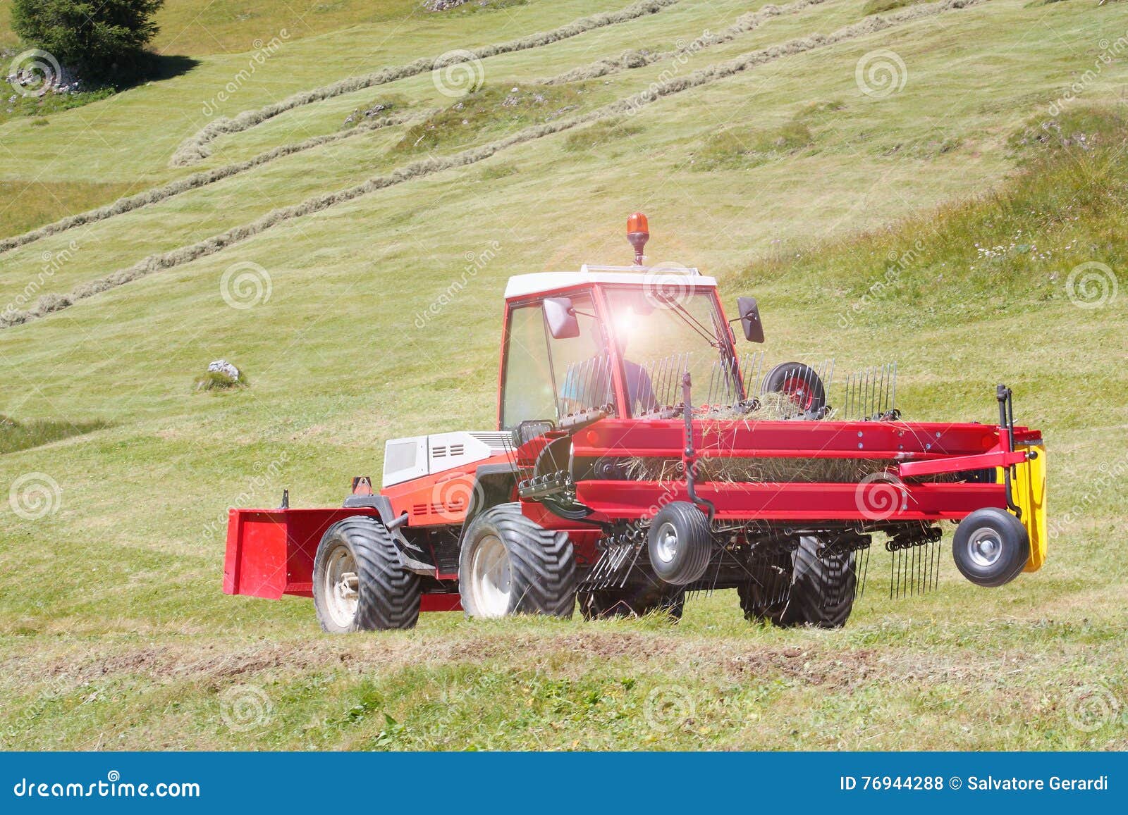 Tractor with Windrower Swather Moving on a Gravel Road Stock Photo ...
