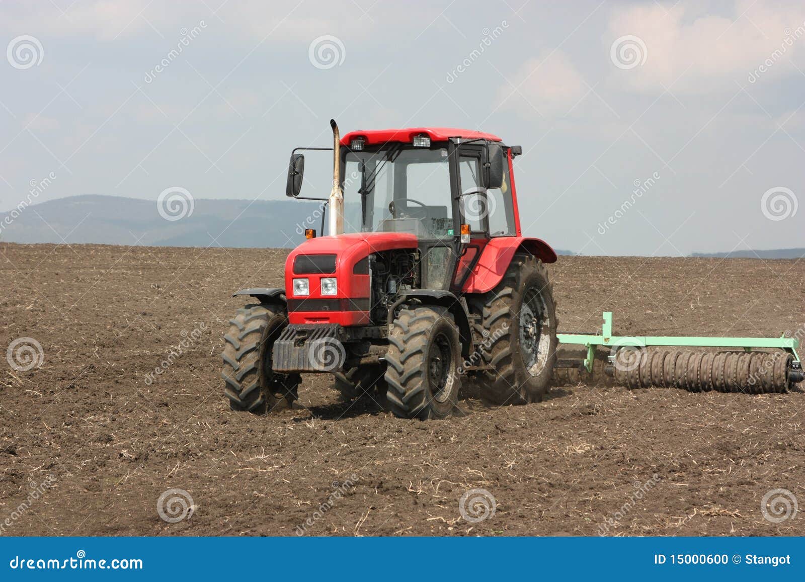 A tractor working stock photo. Image of cultivating, outdoor - 15000600