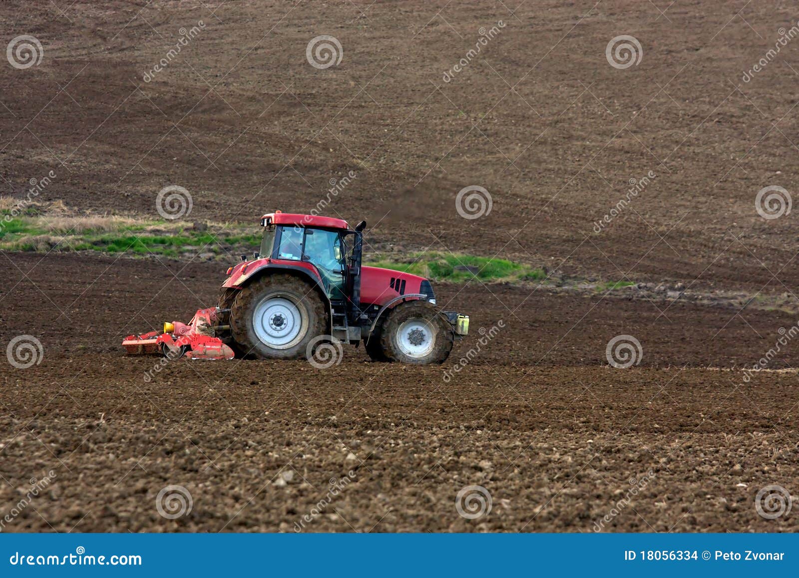 Tractor working on field stock photo. Image of summer - 18056334