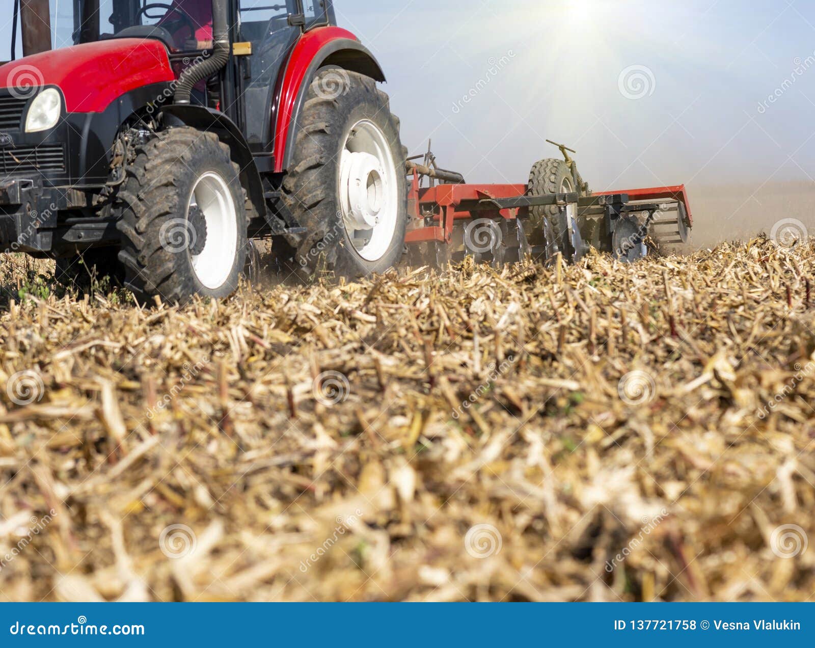 Tractor Working in the Field Stock Photo - Image of horizontal, flora ...