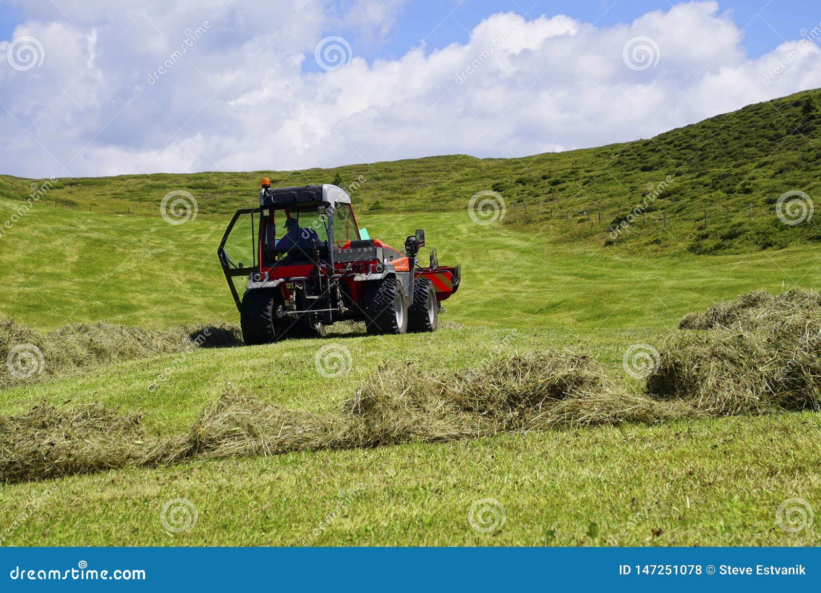 Tractor Working in the Hay Fields in an Alm Pasture Stock Photo - Image ...