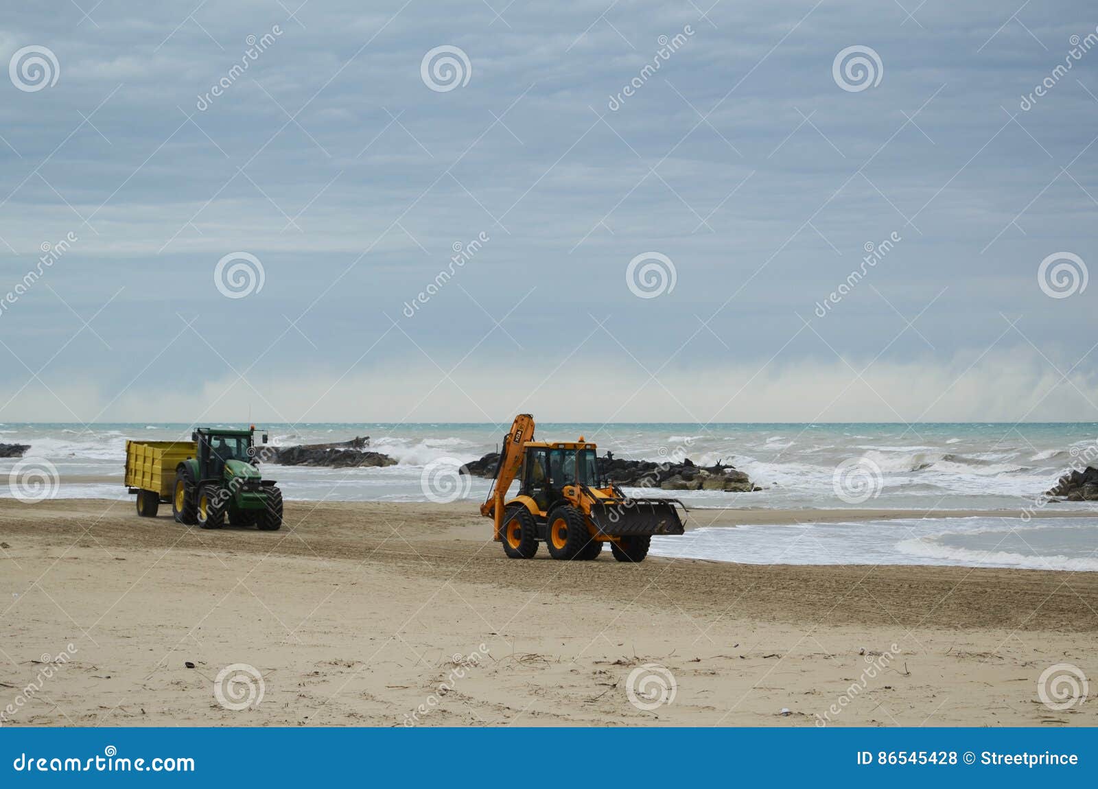 Tractors on the beach stock photo. Image of cliff, bucket - 86545428