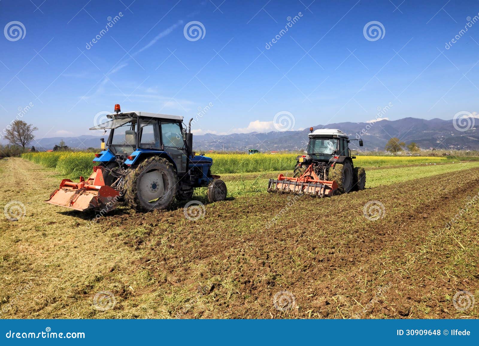 Tractors plowing a field stock photo. Image of farm, dirt - 30909648