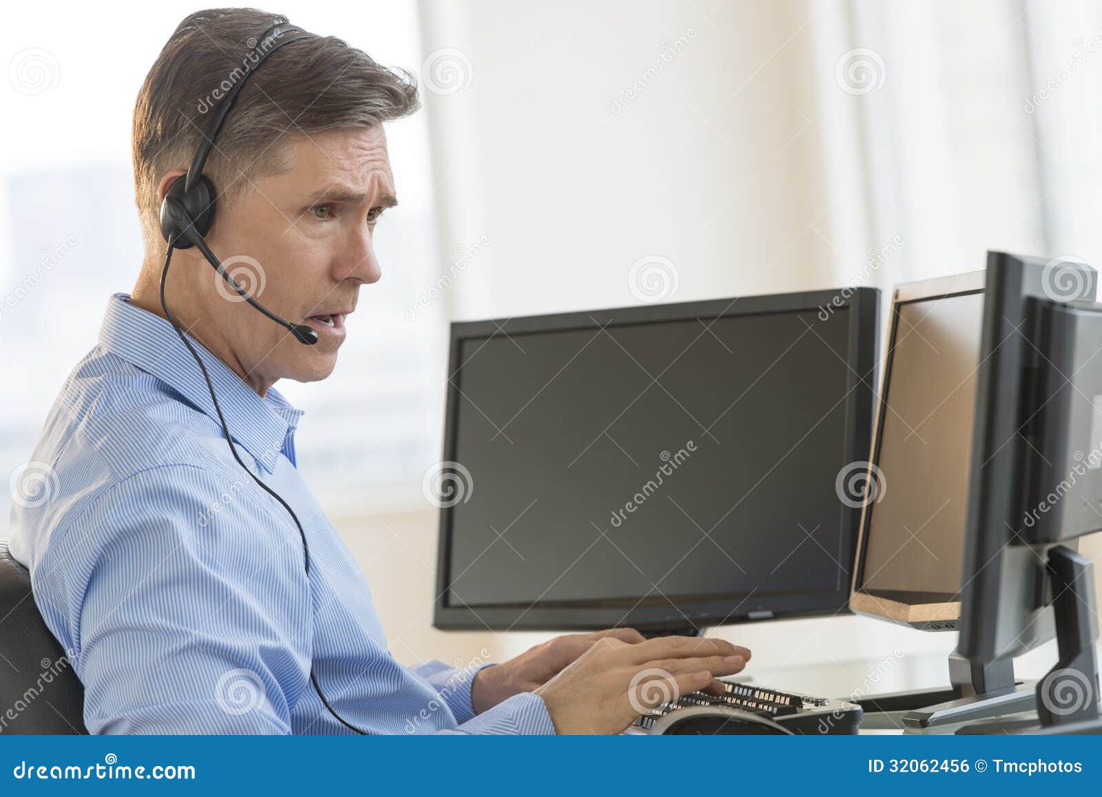 Trader Using Multiple Computer Screens while Communicating through ...