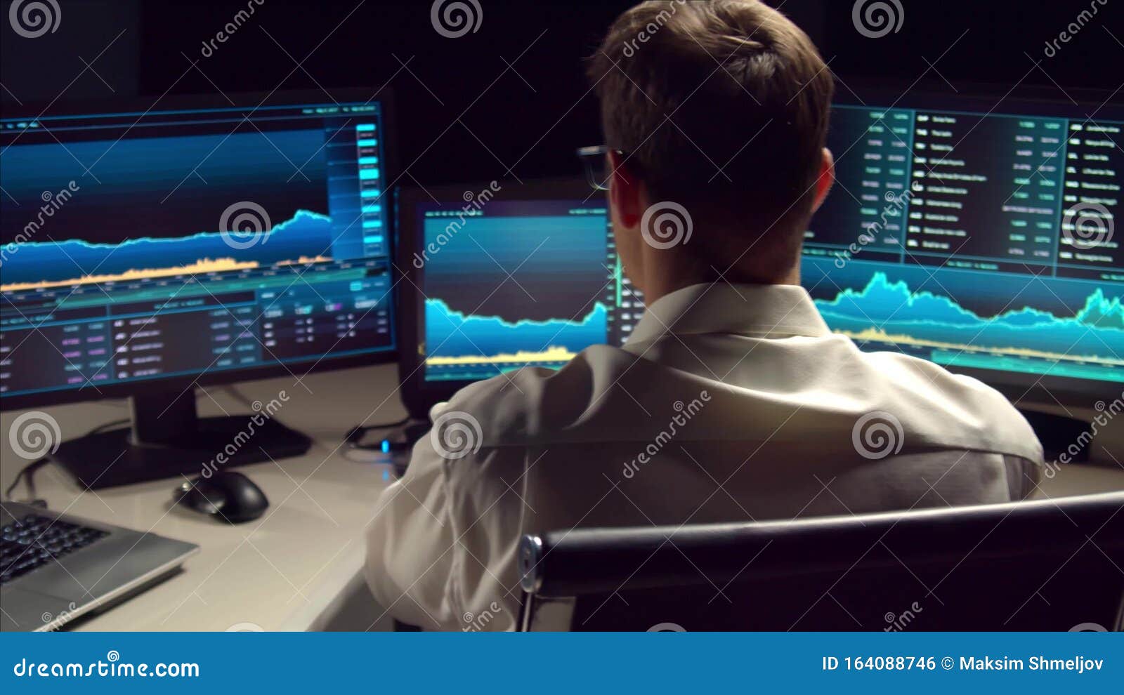 Trader Working in Office at Night Using Workstation and Analysis ...