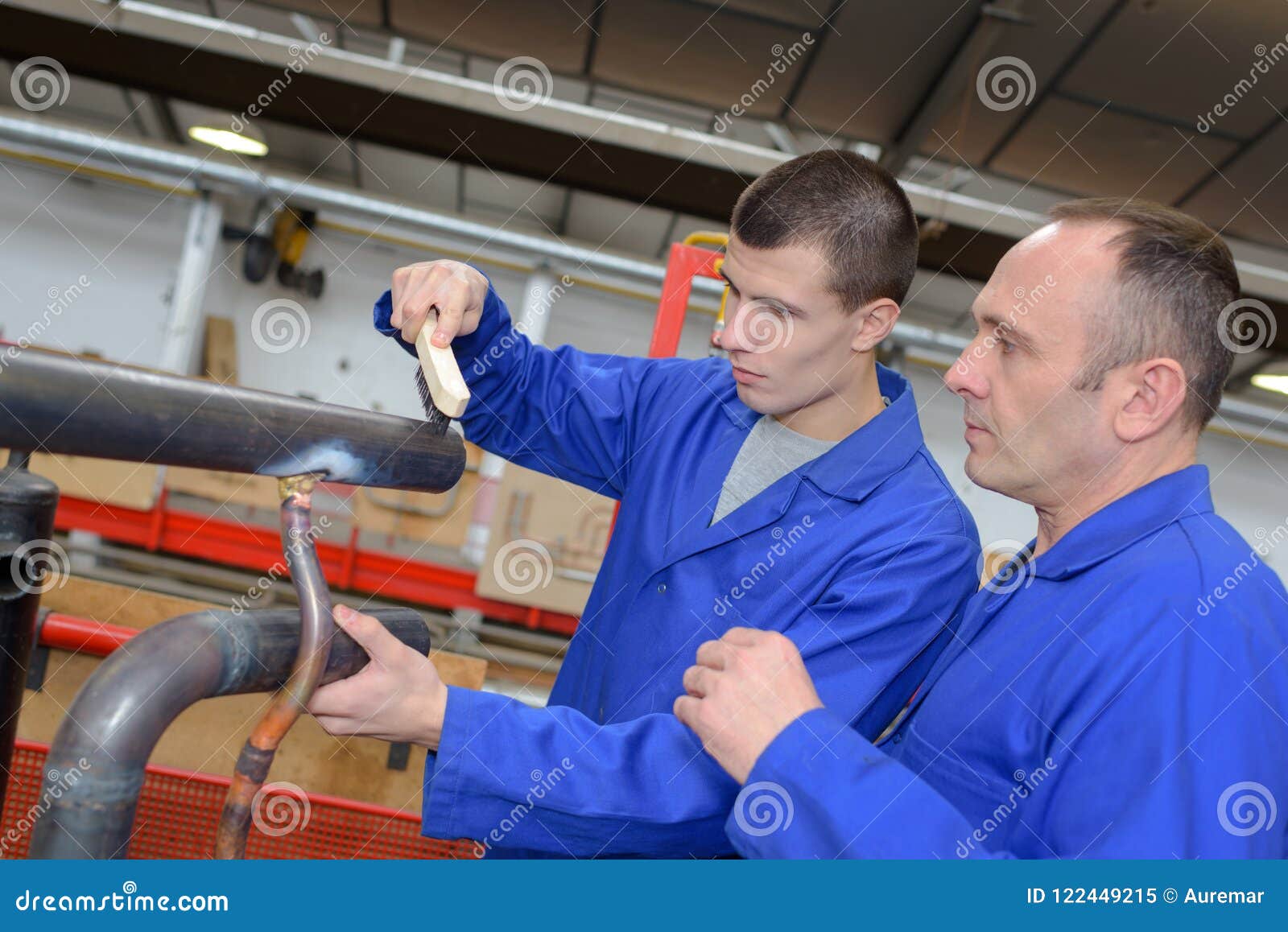 Tradesman Training Two Apprentices Stock Image - Image of adjustable ...