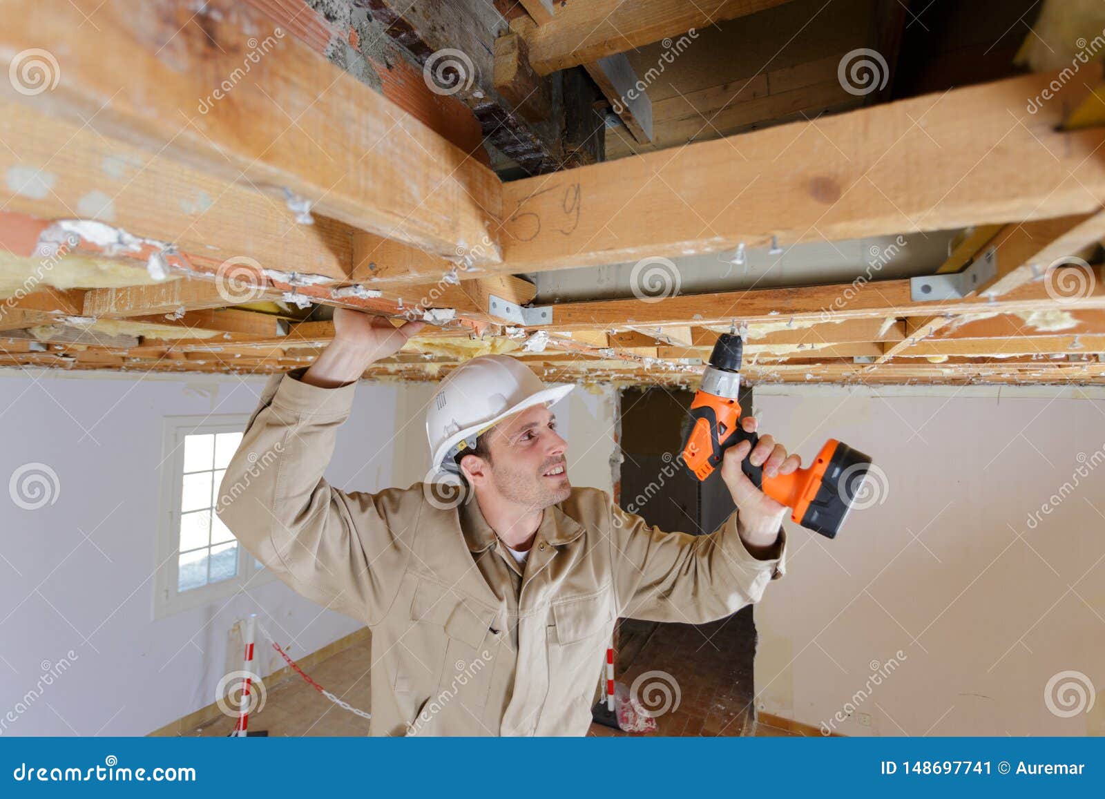 Tradesman Using Drill on Wooden Framework for Ceiling Stock Image ...