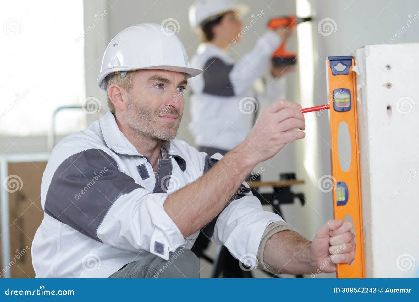 Tradesman Using Spirit Level Vertically Stock Photo - Image of accuracy ...
