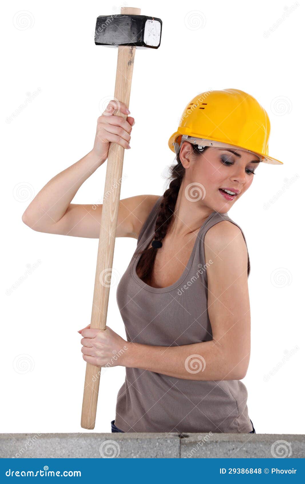 Tradeswoman using a mallet stock photo. Image of head - 29386848