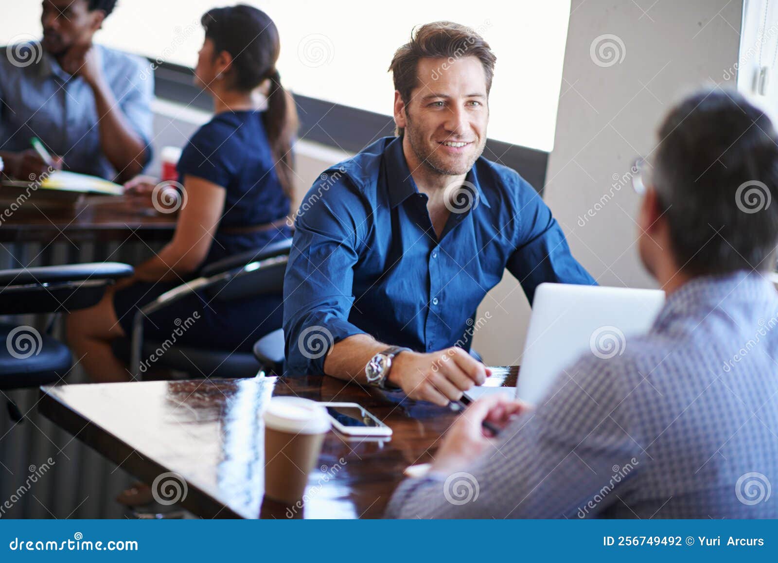 Trading Some Ideas. Two Businessmen Talking in an Office. Stock Photo ...