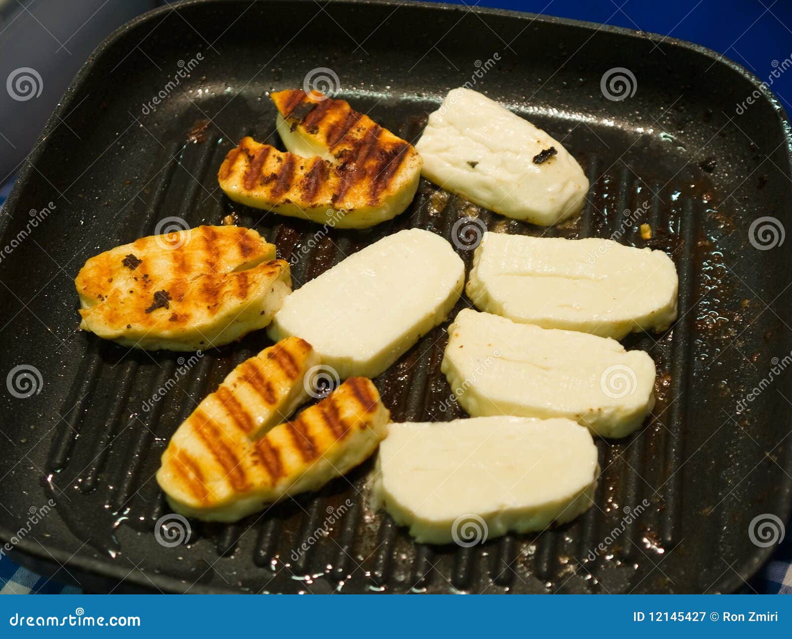 Halloumi Cheese Stack On A White Plate With Mint Leaves Royalty-Free ...