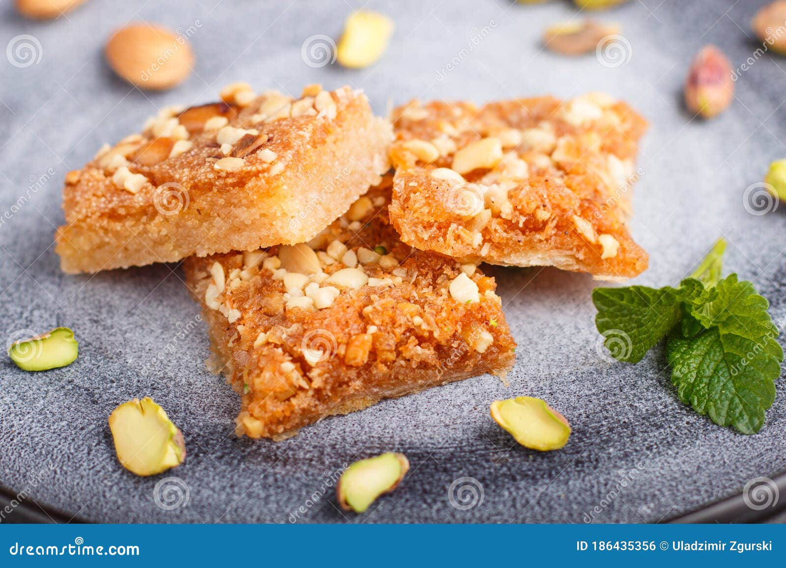 Traditional Arabic Sweets in Gray Ceramic Plate on a Gray Concrete ...