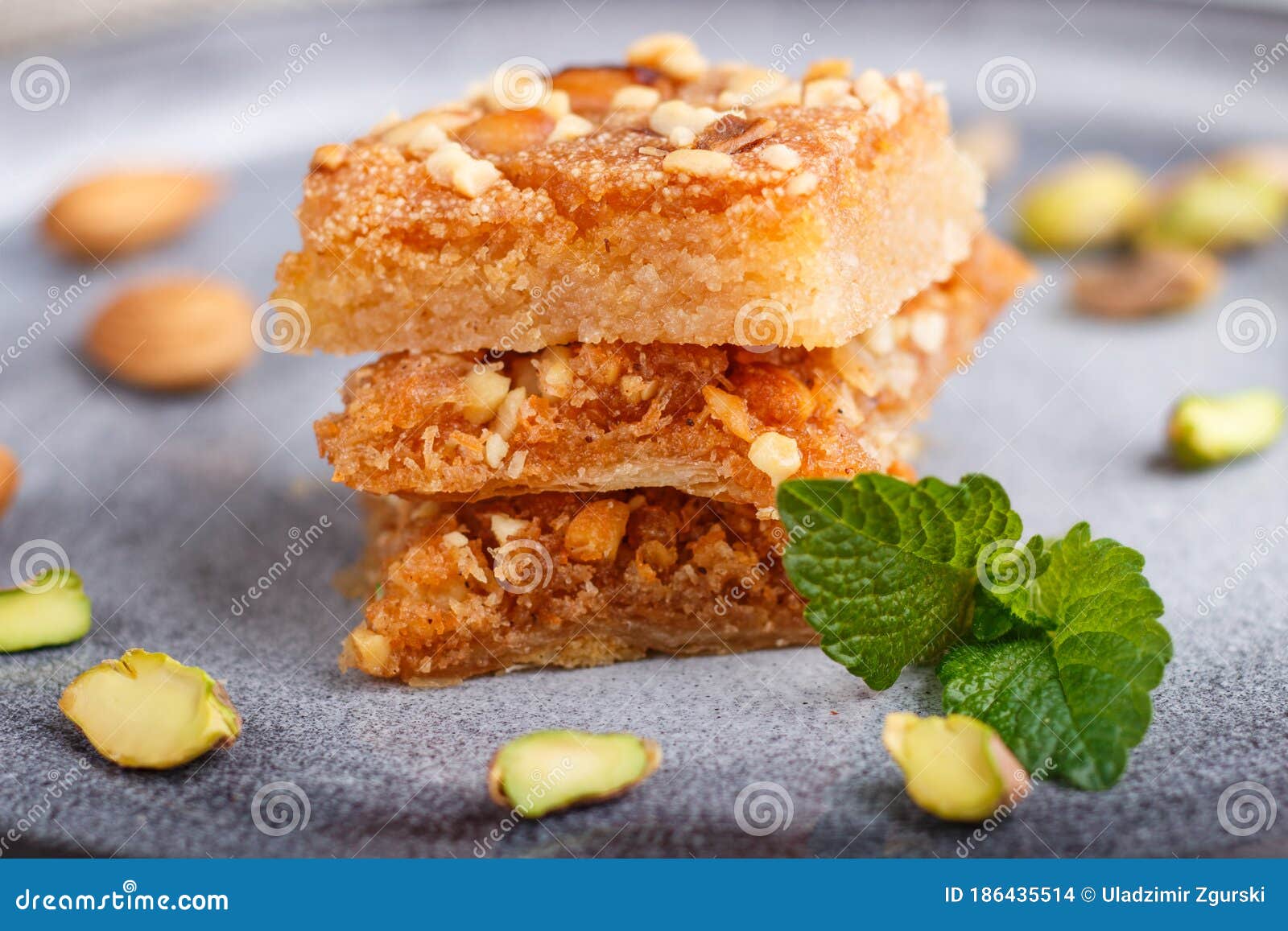 Traditional Arabic Sweets in Gray Ceramic Plate on a Gray Concrete ...