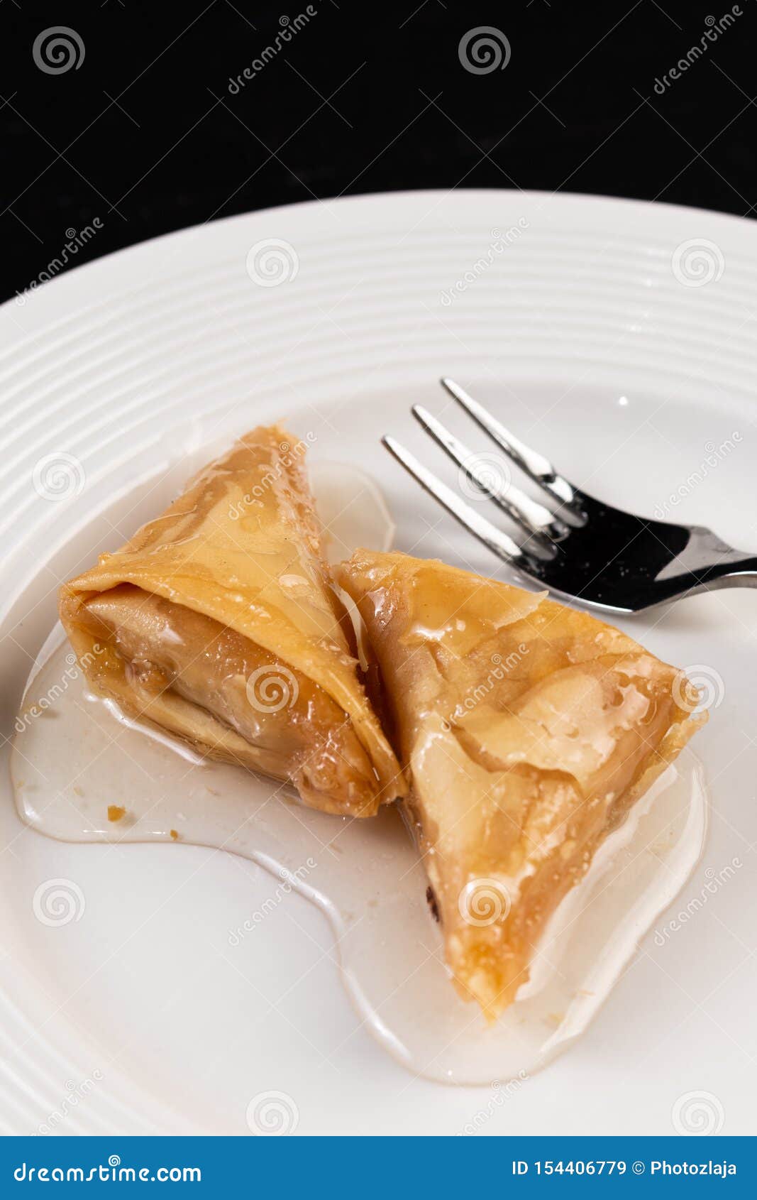 Traditional Balkan Baklava Cake with Walnuts Served on the Plate Stock ...