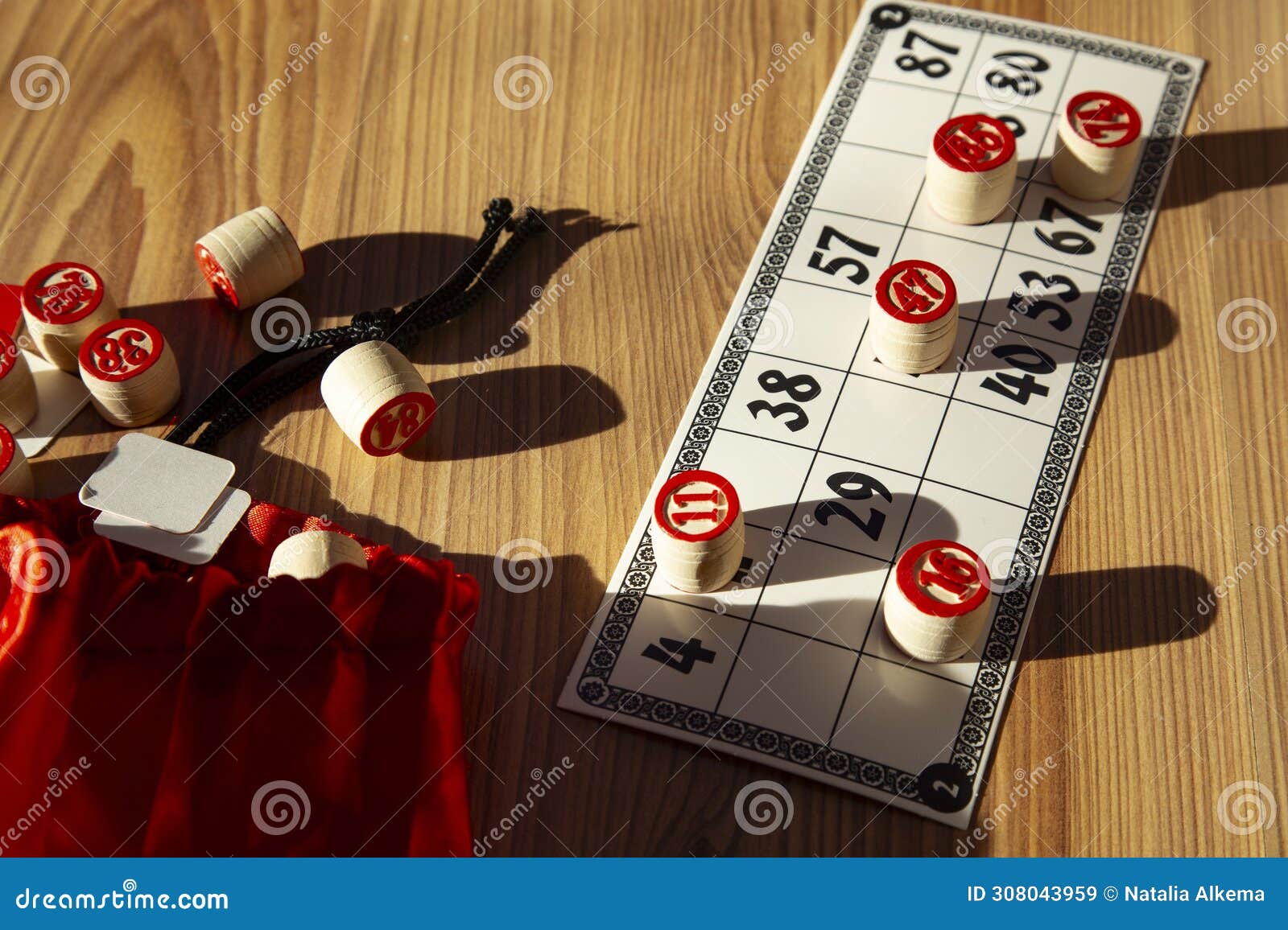 Traditional Bingo Cards and Counters on Wooden Table in Sunlight Stock ...