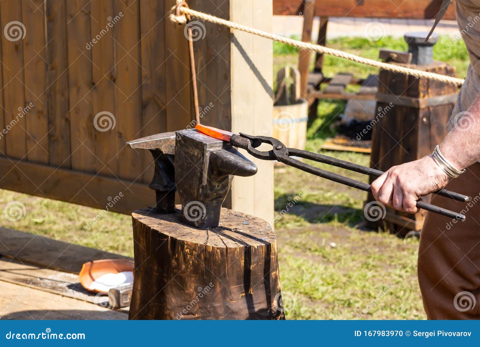 Traditional Blacksmith`s Workshop, Anvil Blacksmith Forms a Sword from ...