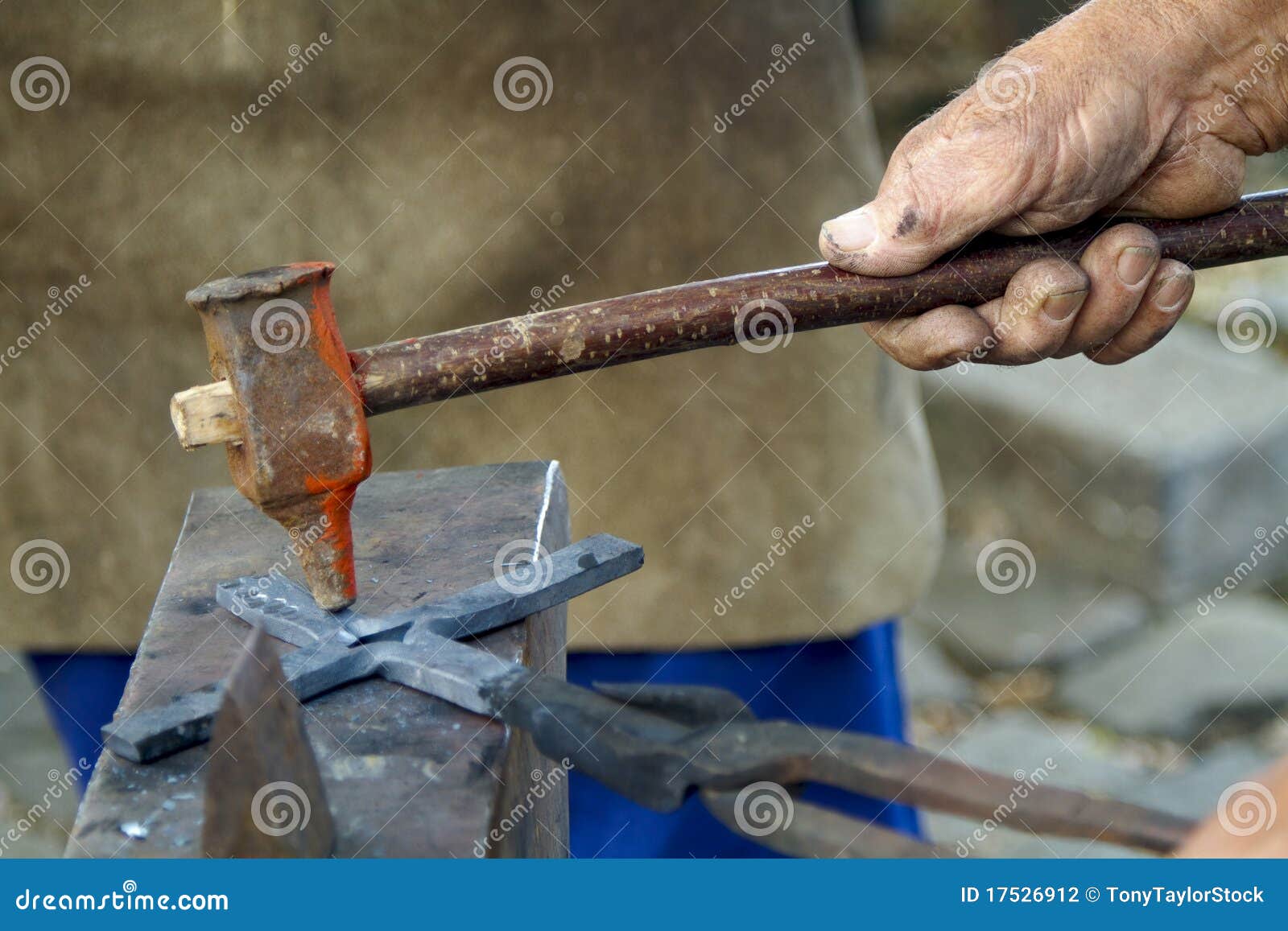 Traditional Blacksmith Uses Bellows To Keep A Fire Royalty-Free Stock ...