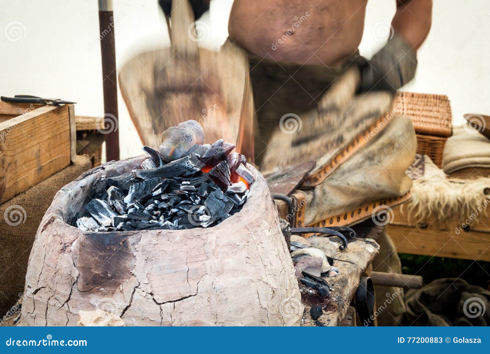 Traditional Blacksmith Uses Bellows To Keep a Fire Stock Image - Image ...
