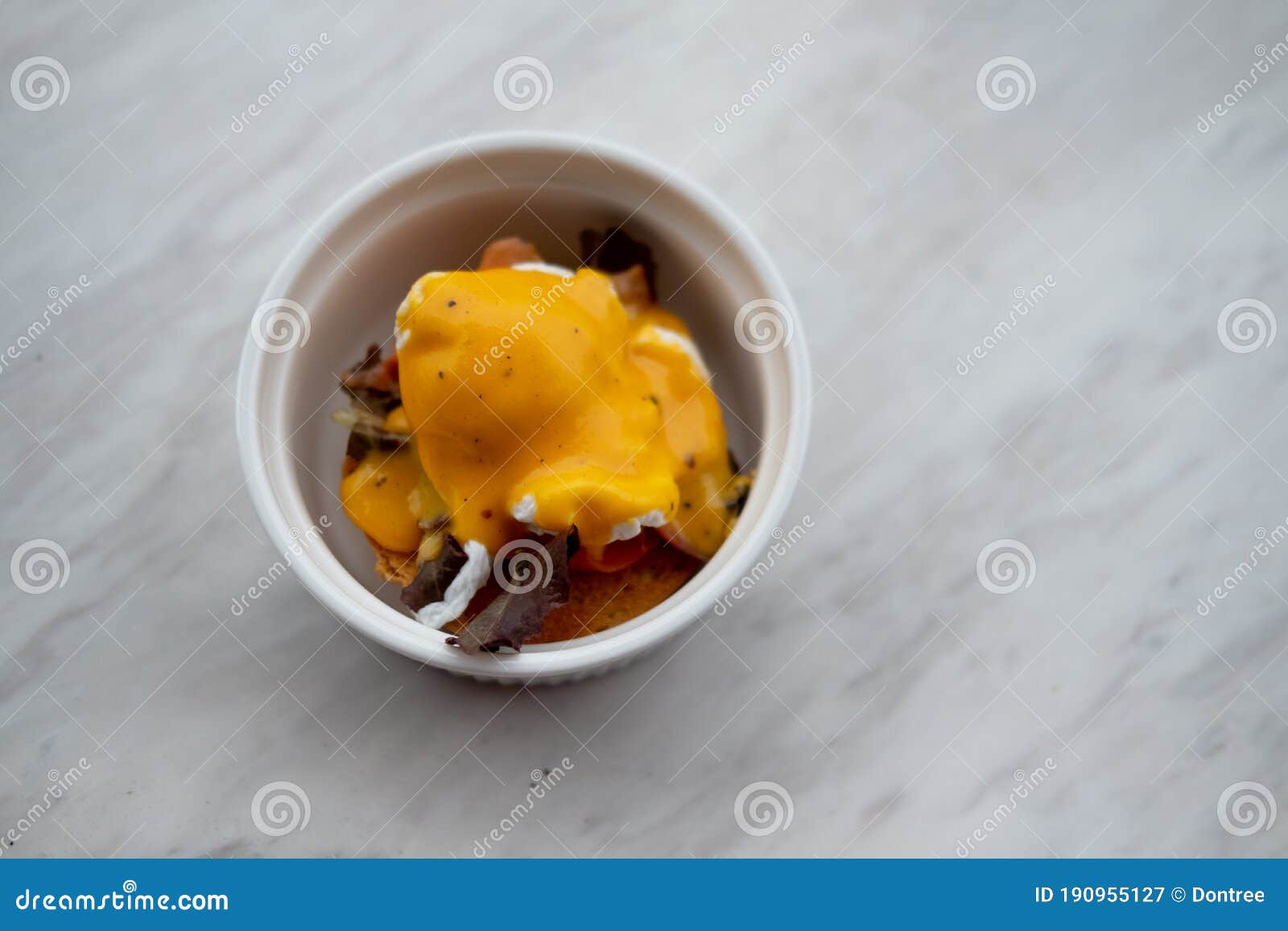 Traditional Breakfast. Eggs Benedict on a White Bowl Stock Image ...