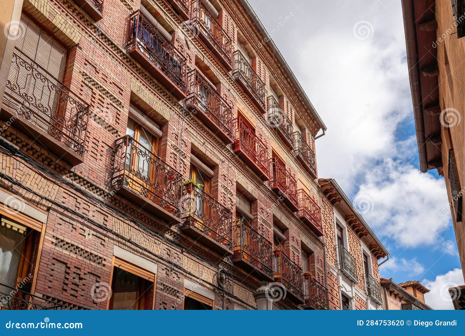 Traditional Brick Building Facade with Balconies - Segovia, Spain Stock ...