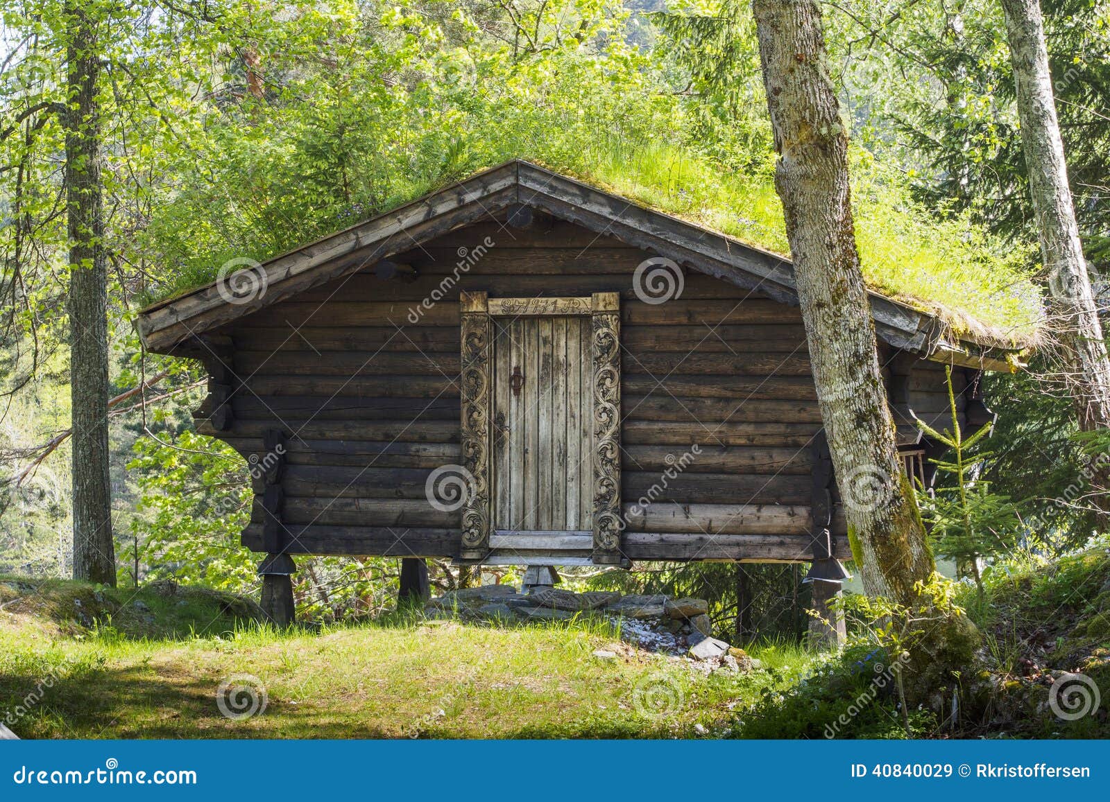 Traditional Cabin in the Forest with Grass on the Roof Stock Image ...