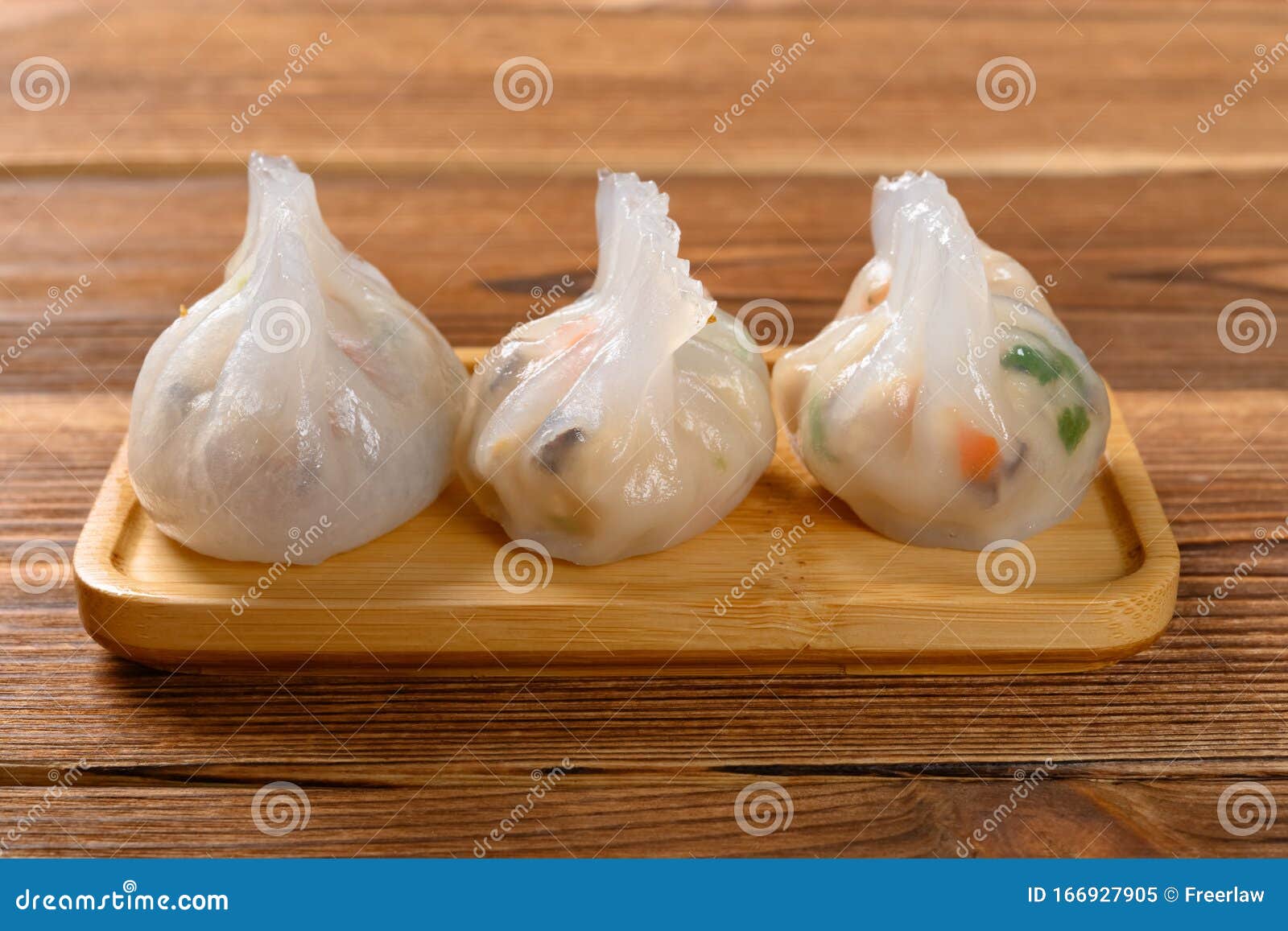 Traditional Cantonese Style Dumplings on a Wood Table Stock Image ...