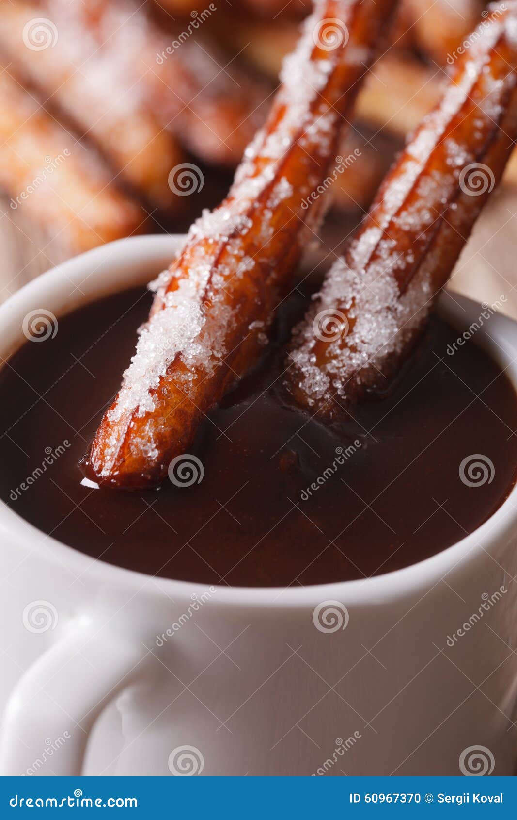 Traditional Churros Dipped in a Cup of Chocolate Macro. Vertical Stock ...