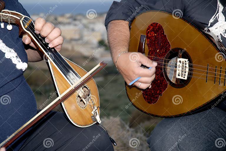 Traditional Cretan Musicians Stock Photo - Image of instrument, sound ...