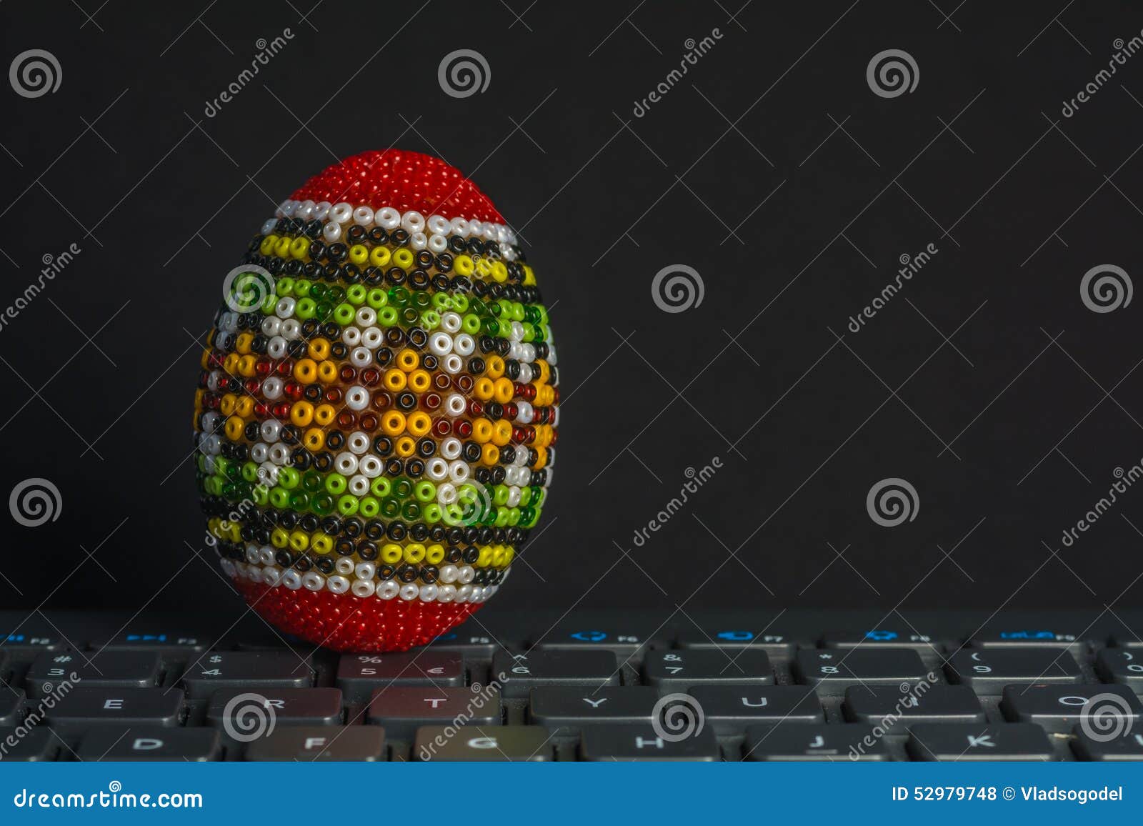 Traditional Decorated Eastern Egg Over Computer Keyboard Isolated on ...