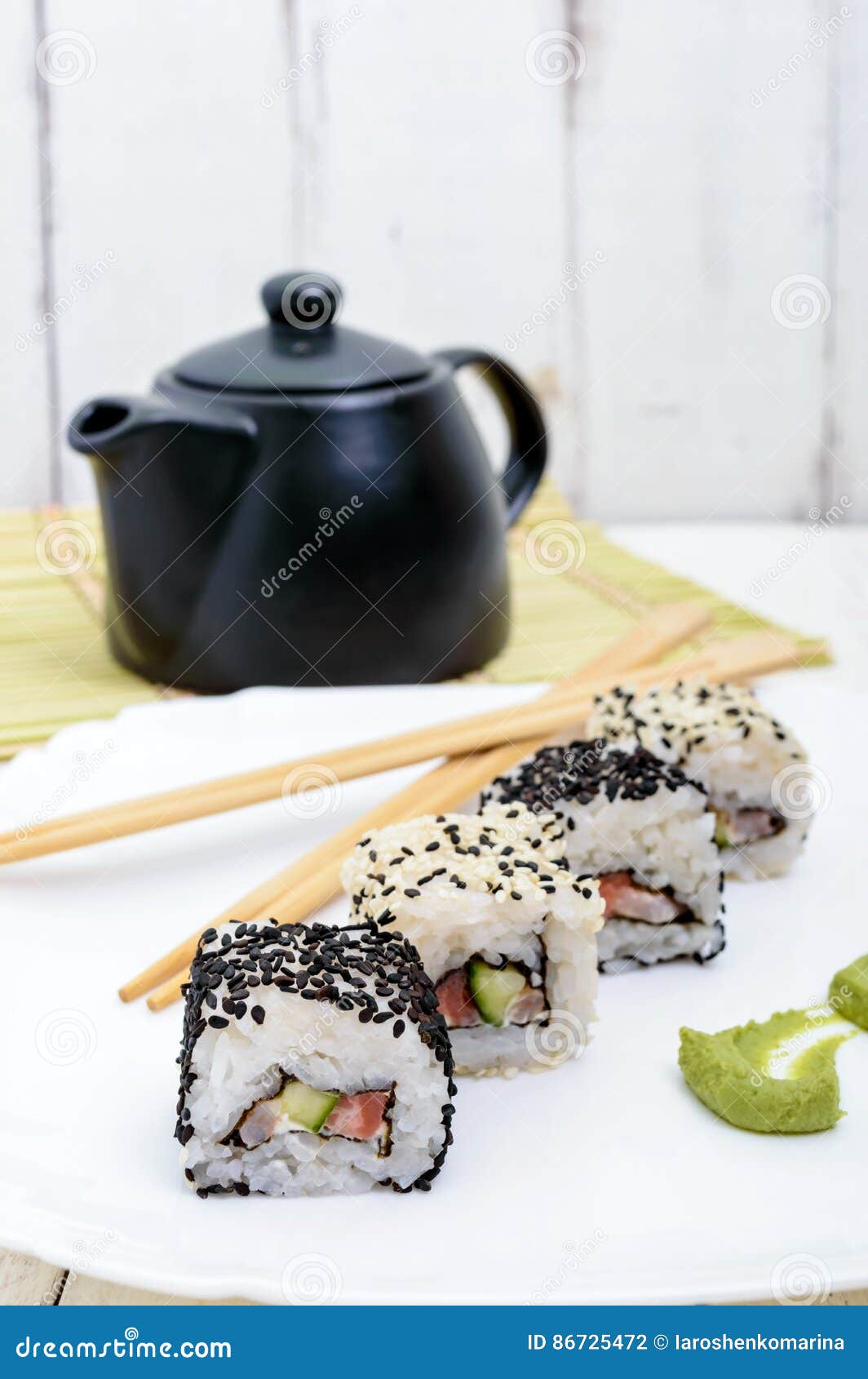 Traditional Eastern Dish with Salmon, Shrimp - Sushi Rolls on a White ...