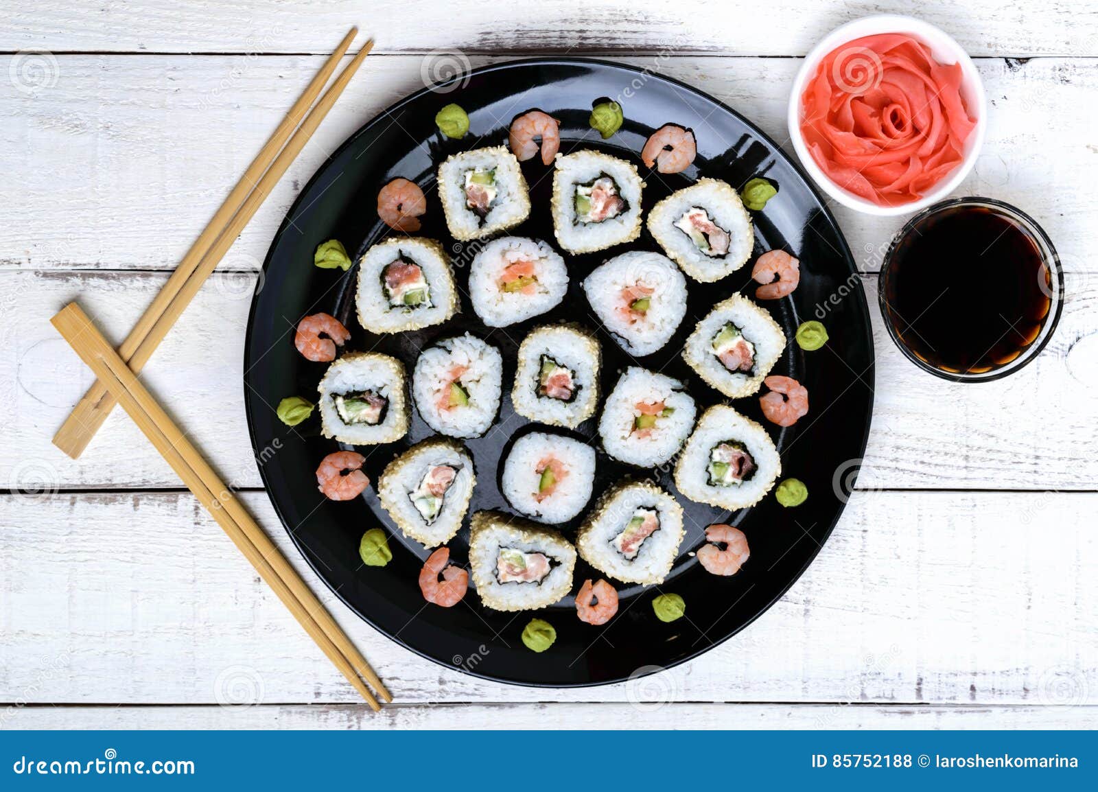 Traditional Eastern Dish with Salmon Sushi Rolls on a Black Plate ...