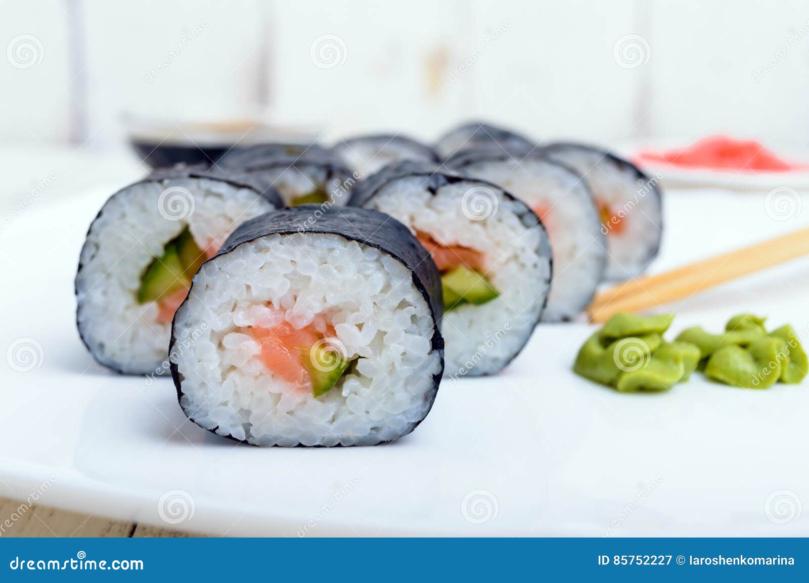 Traditional Eastern Dish with Salmon Sushi Rolls on a White Plate ...