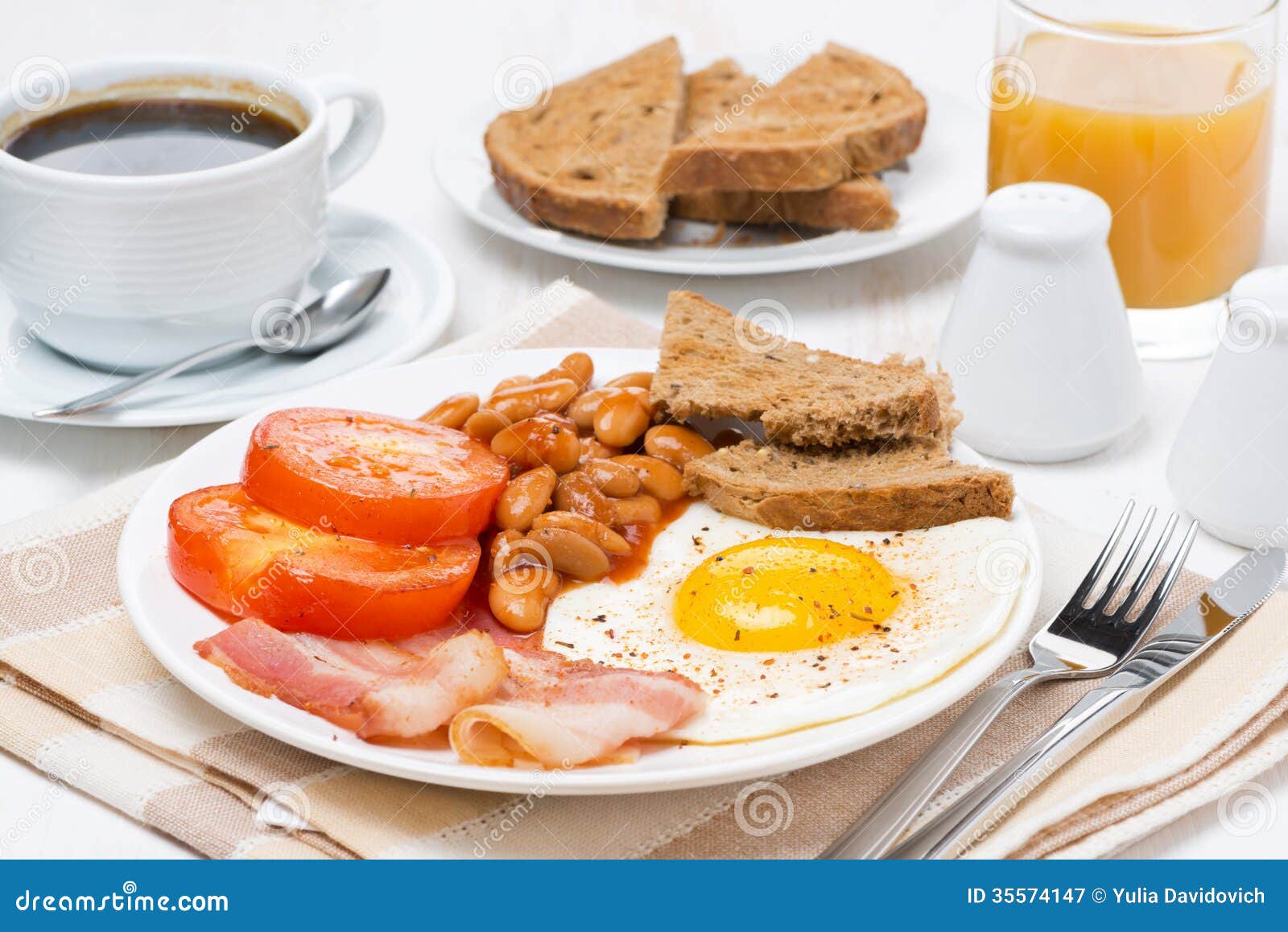 Traditional English Breakfast with Fried Eggs, Bacon and Beans Stock ...
