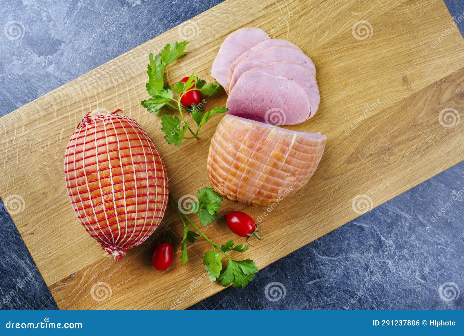 Traditional German Boiled Easter Ham with Tomatoes and Parsley on a ...