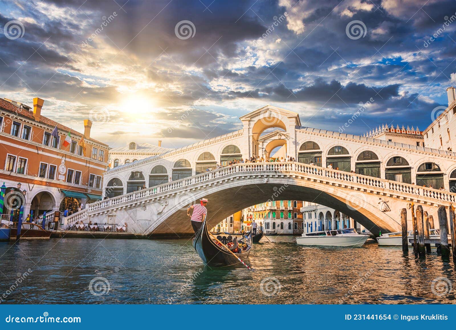 Traditional Gondola Near World Famous Canal Grande And Rialto Bridge