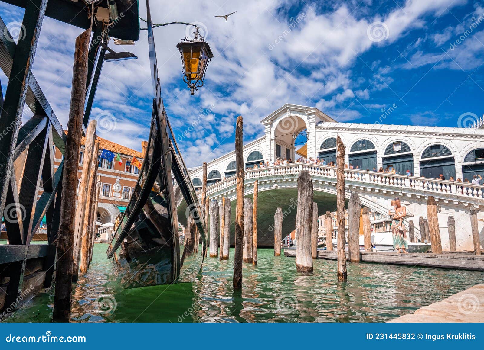 Traditional Gondola Near World Famous Canal Grande And Rialto Bridge