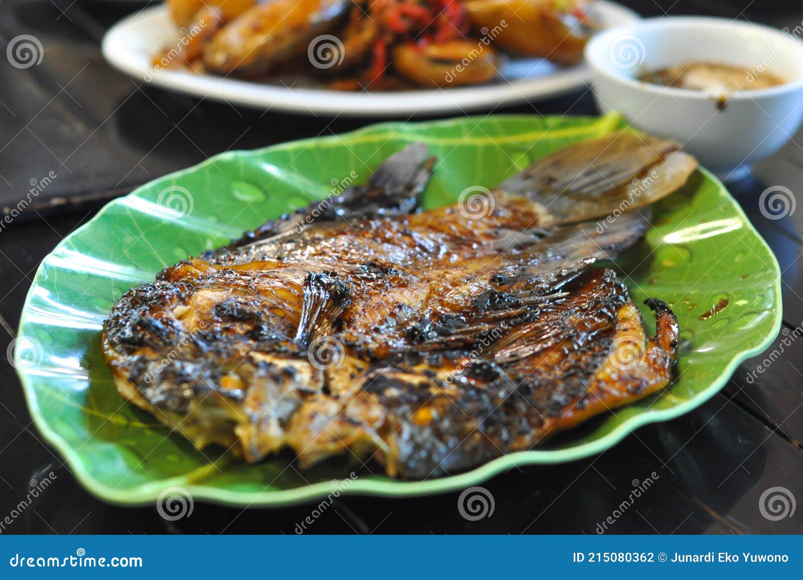 A traditional grilled Fish stock photo. Image of produce - 215080362