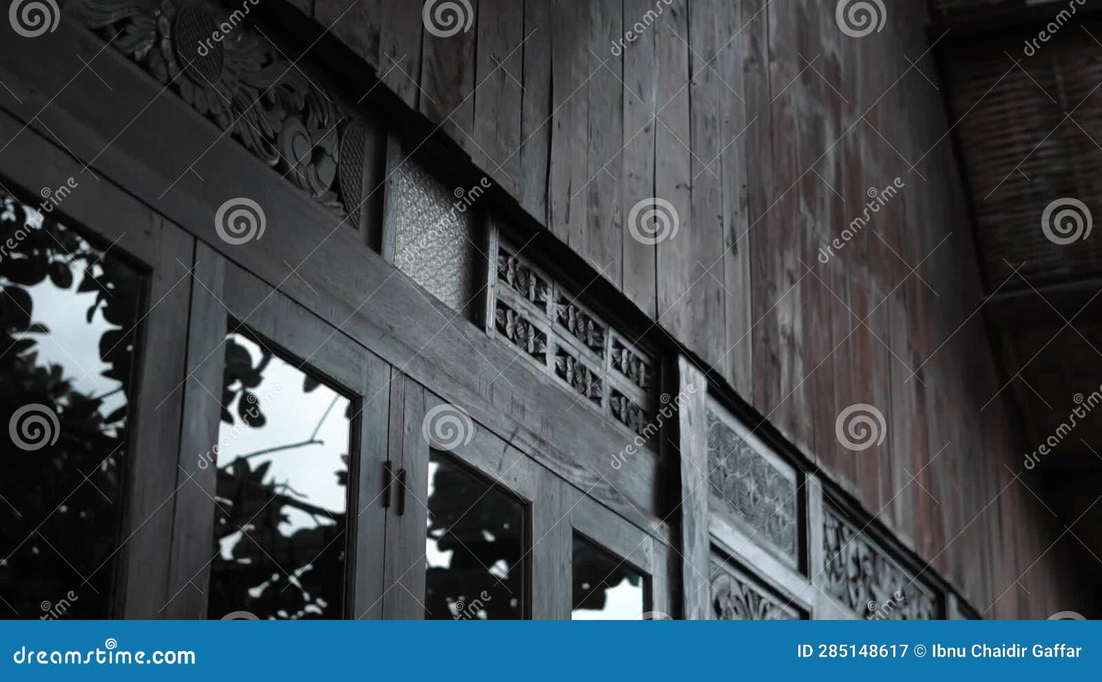 A Traditional House with a Brown Pattern and Stained Glass Windows ...