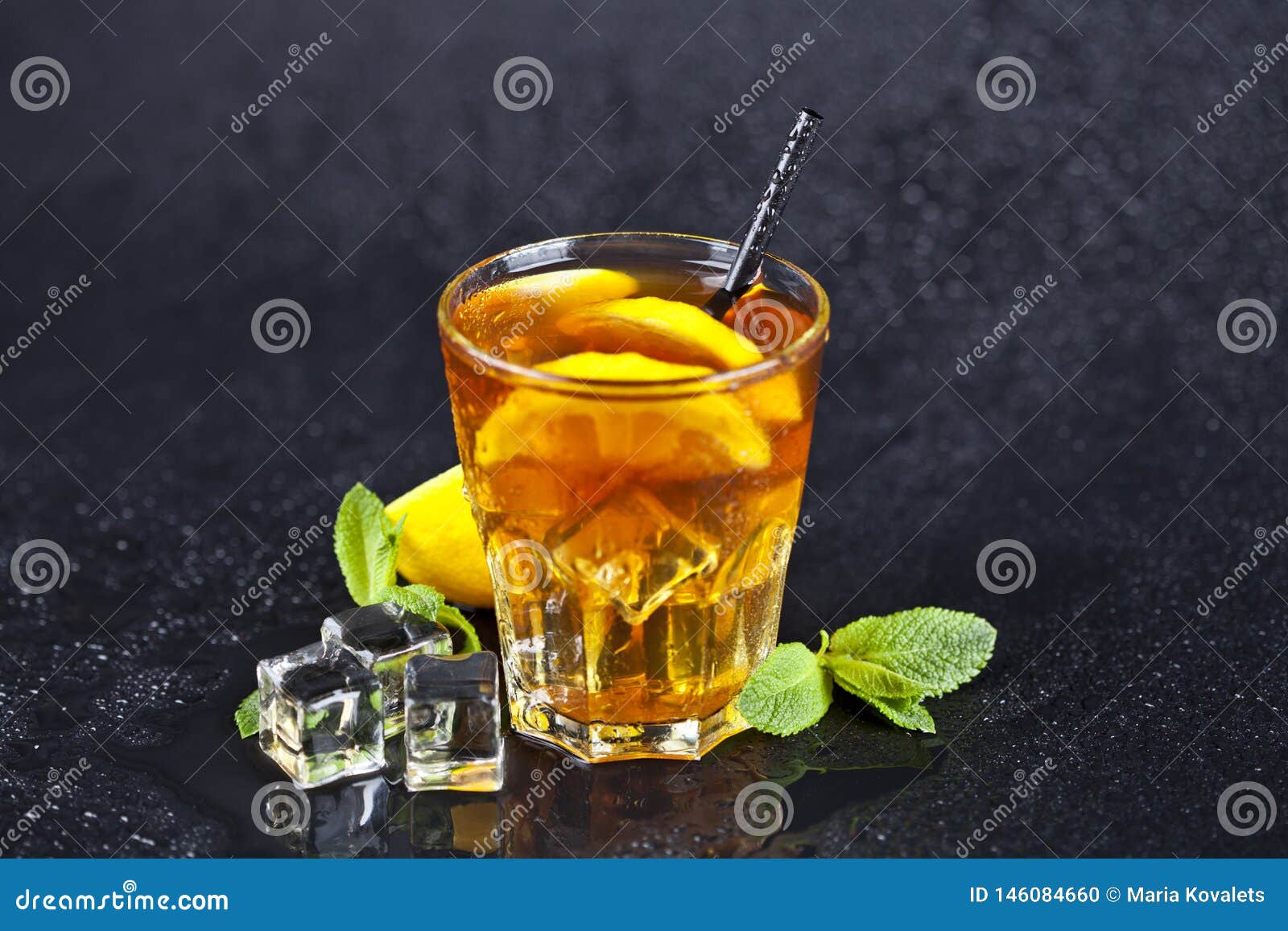 Traditional Iced Tea With Lemon Mint Leaves And Ice Cubes In Glass On