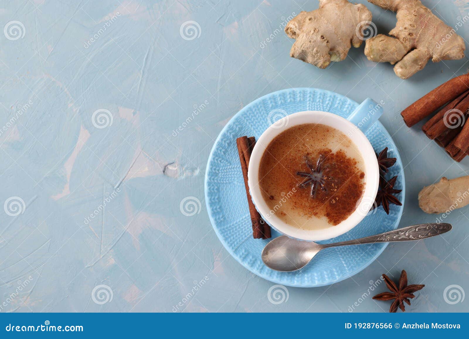 Traditional Indian Masala Tea with Spices in Blue Cup on Light Blue ...