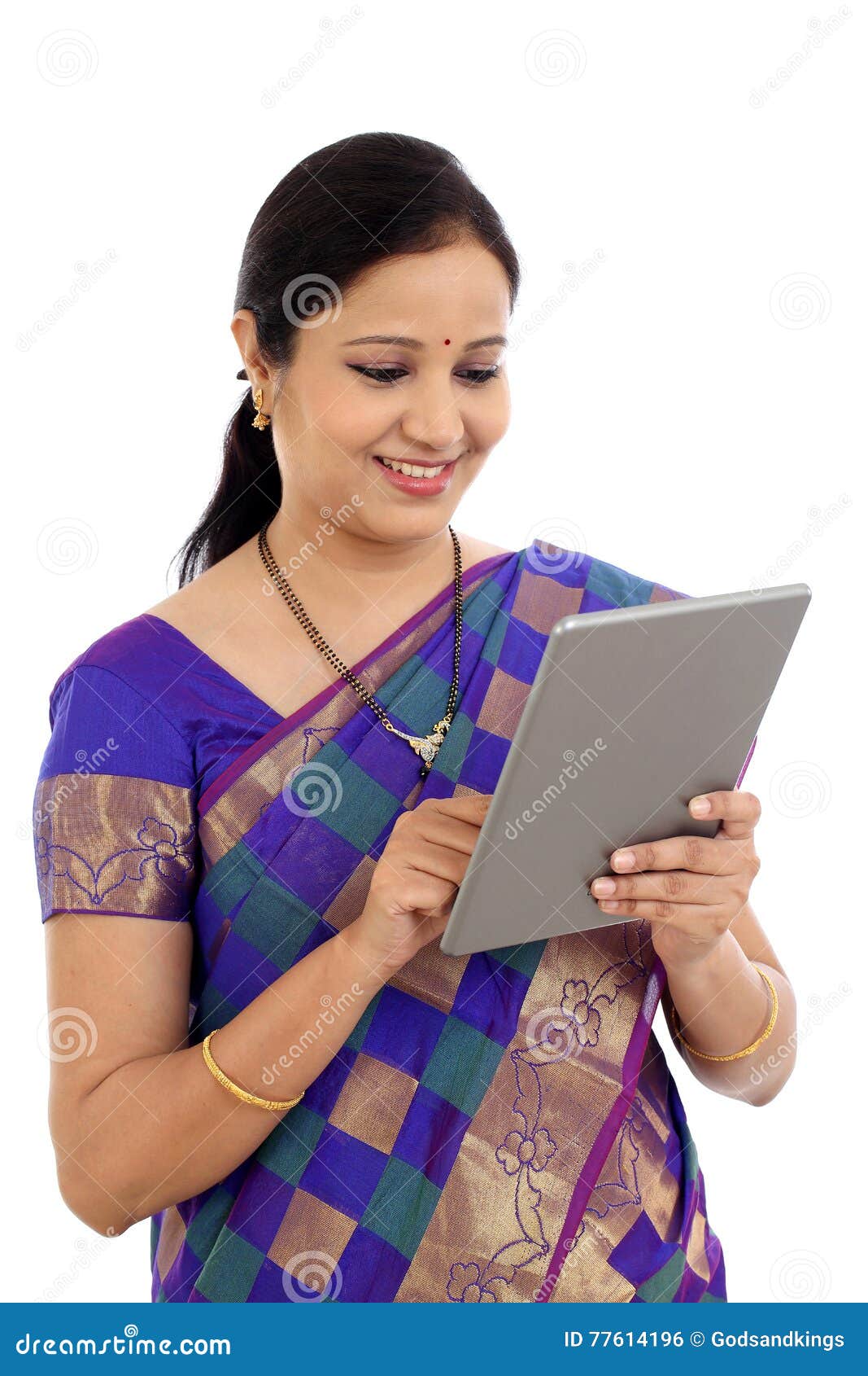 Traditional Indian Woman Using a Tablet Computer Stock Photo - Image of ...