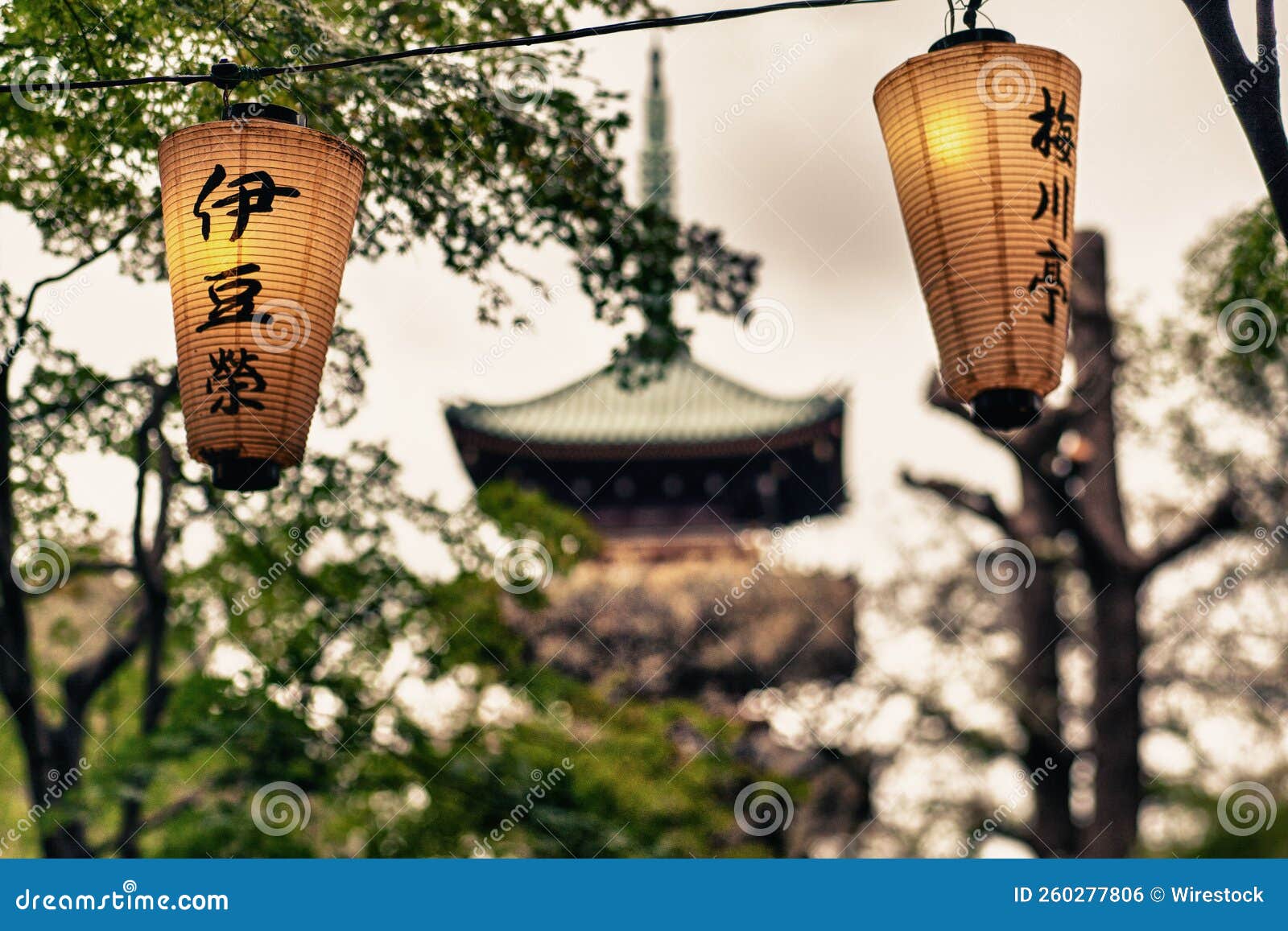 Traditional Japanese Lanterns with the Temple in the Background in a ...