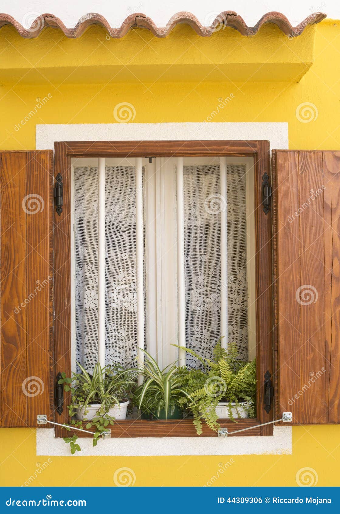 Traditional Mediterranean Window on Yellow Wall Stock Photo - Image of ...