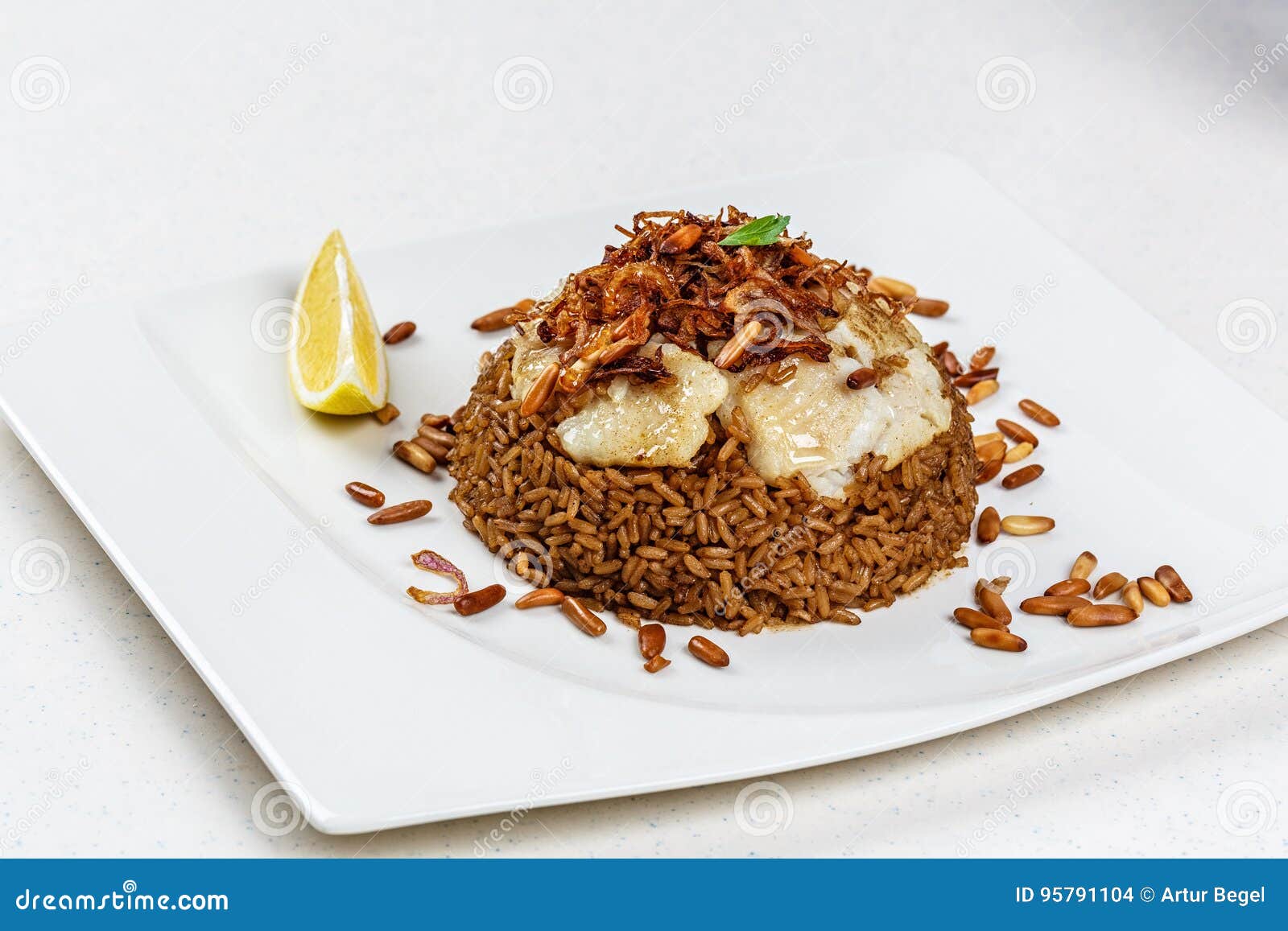 Traditional Middle Eastern Fish and Fried Rice Dish with Fried Pine ...