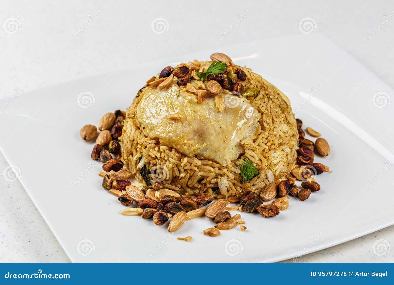 Traditional Middle Eastern Fish and Fried Rice Dish with Fried Pine ...