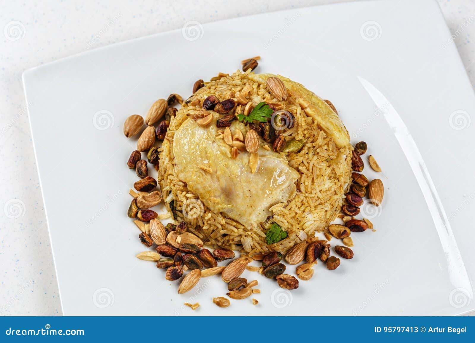 Traditional Middle Eastern Fish and Fried Rice Dish with Fried Pine ...